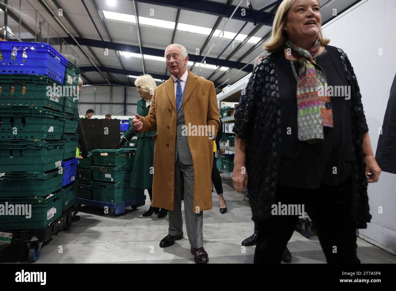 Britain's King Charles III, centre and Queen Camilla arrive to visit ...