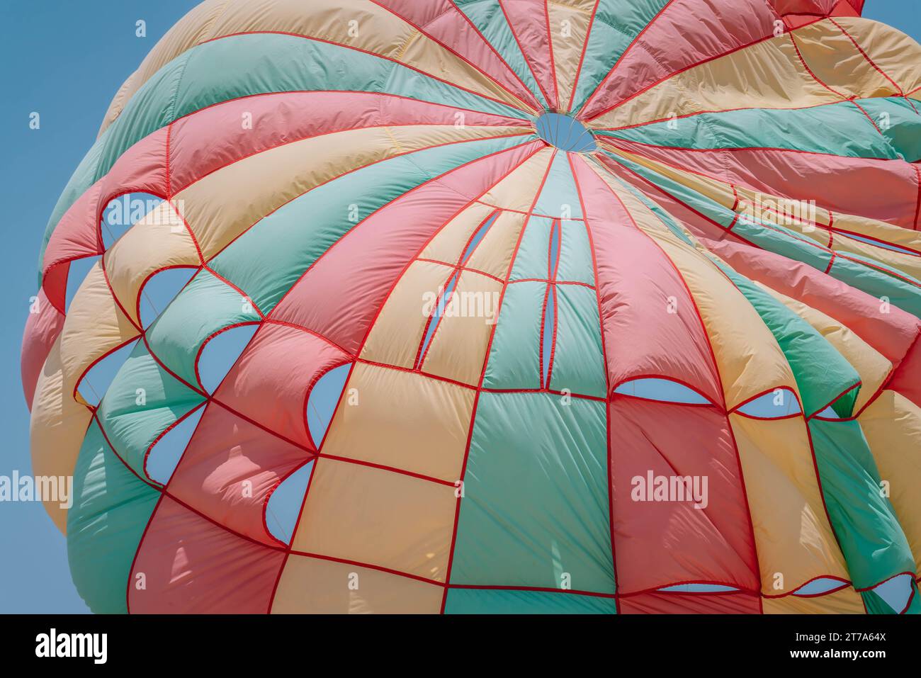 Very close up photo of open colorful parachute, flying in an air. Sunny ...