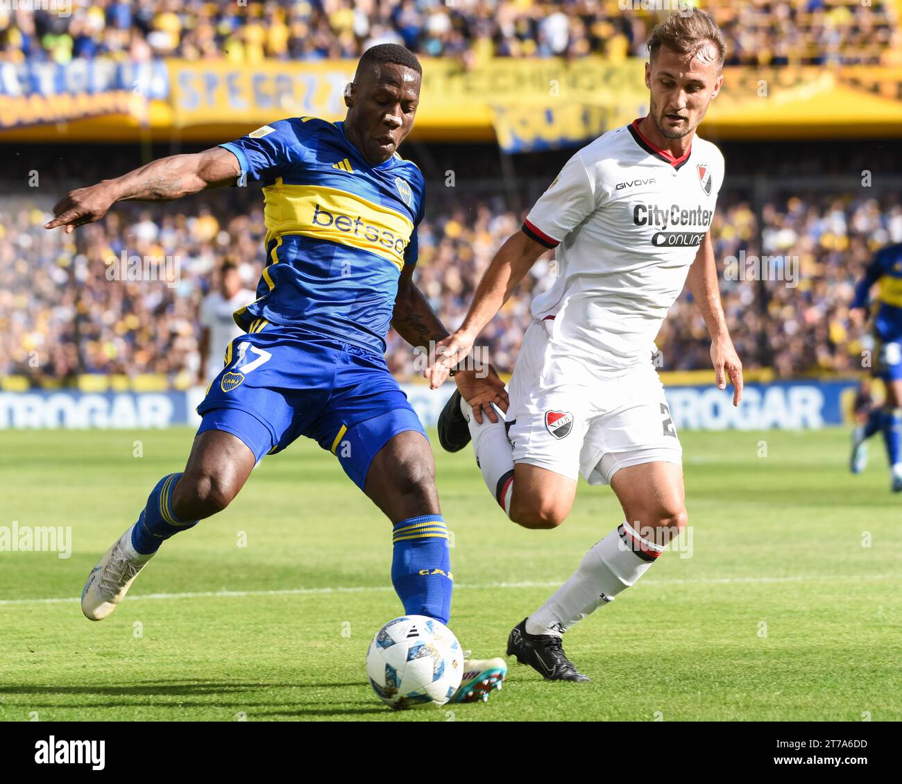 Luis Advincula of Boca Juniors and Angelo Martino of Newells during the ...