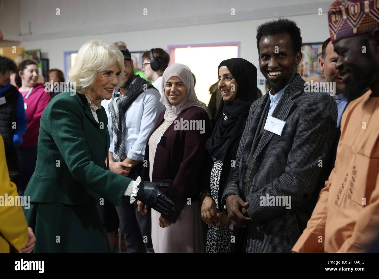 Britain's Queen Camilla, left, meets staff as she visits FareShare with ...