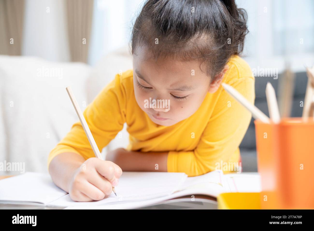 Little kid doing homework at home Stock Photo - Alamy