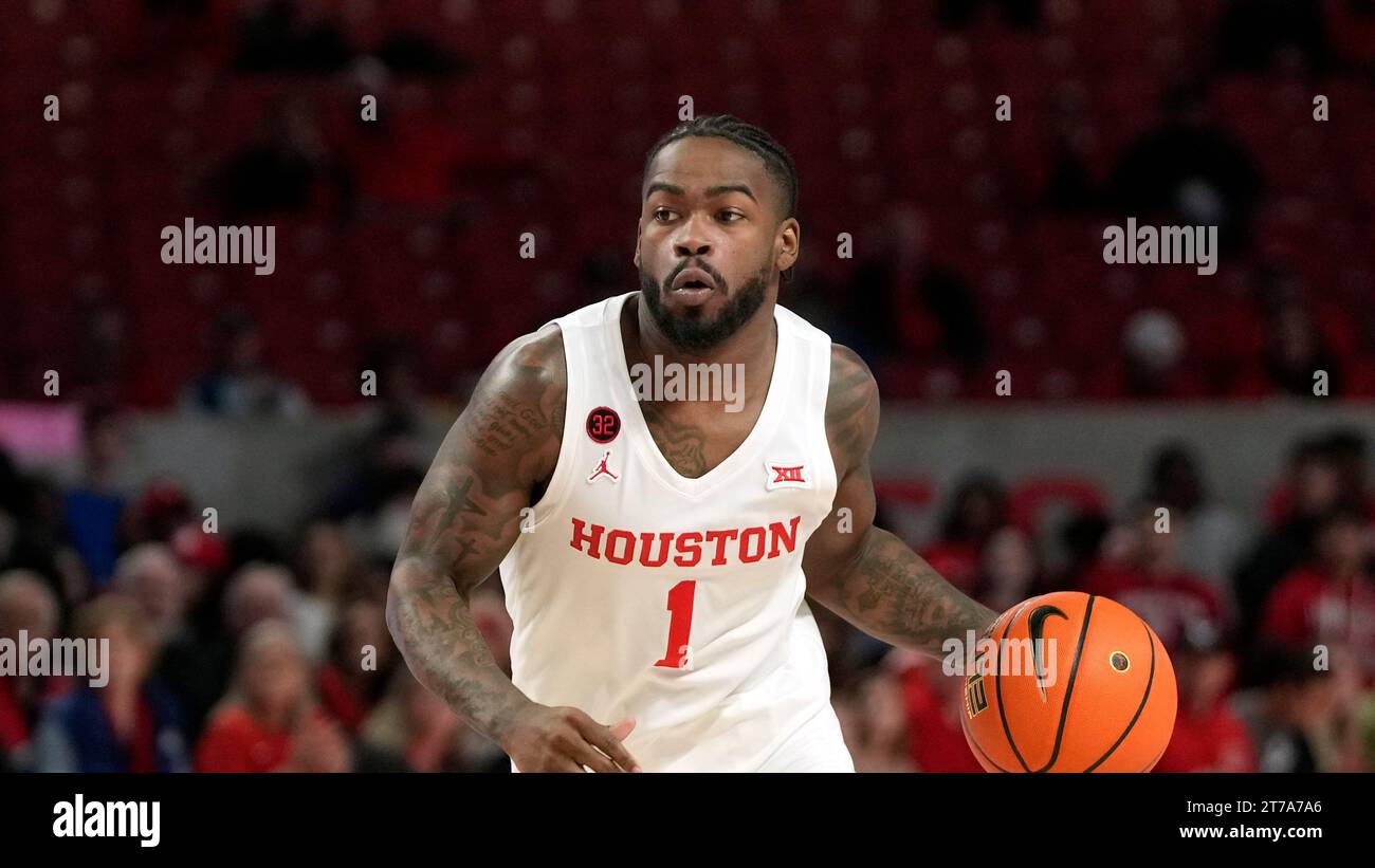 Houston's Jamal Shead (1) brings the ball up the court against Texas A ...