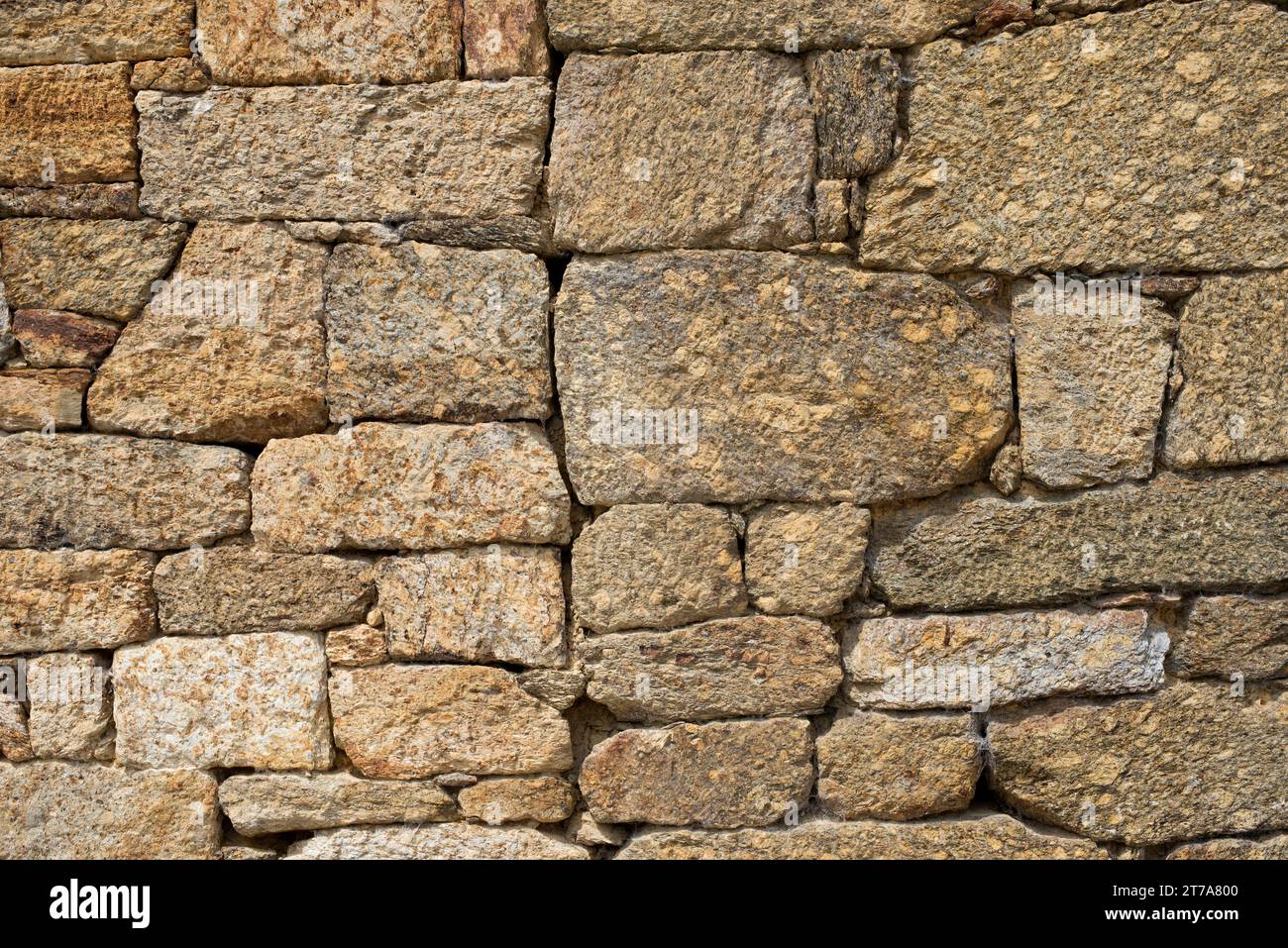 Wall built with blocks of gneiss. Gneiss is a metamorphic rock of high ...