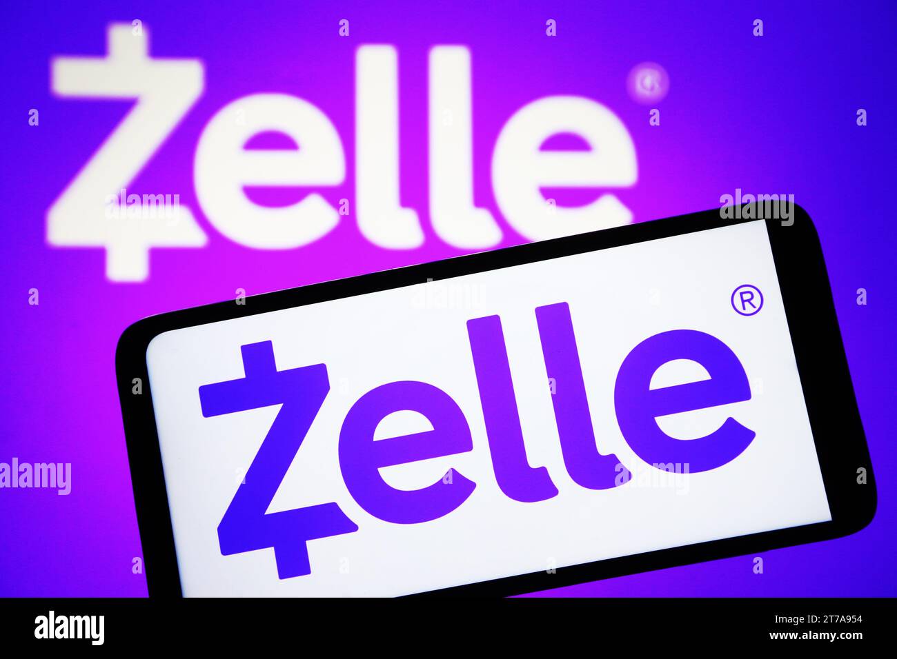In this photo illustration, Zelle logo is seen on a smartphone and on a ...