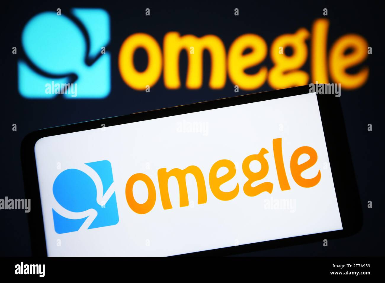 In this photo illustration, Omegle logo is seen on a smartphone and on ...
