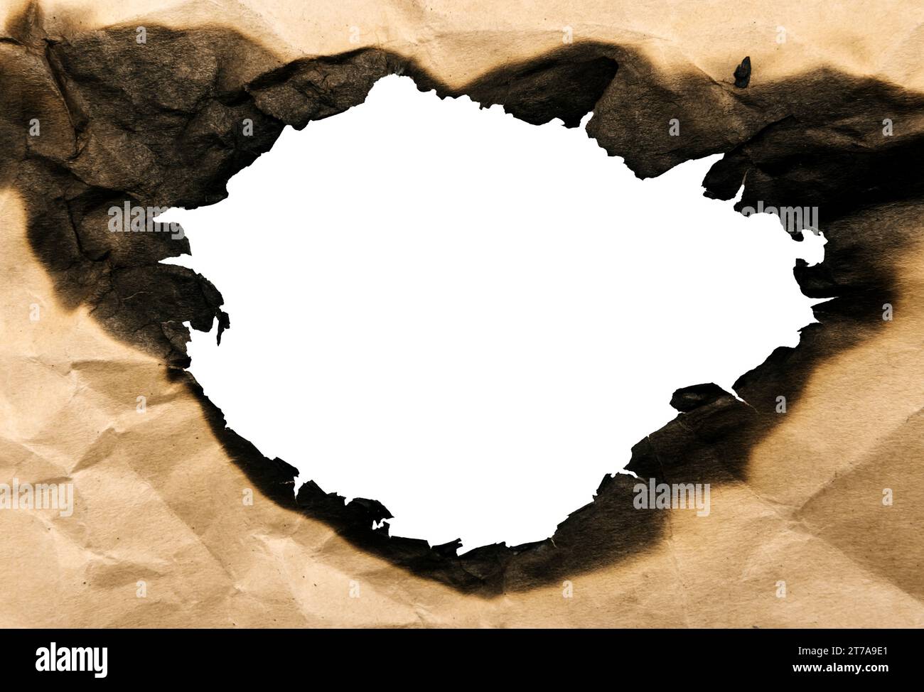 Burnt hole in yellow paper. Burnt paper Stock Photo - Alamy