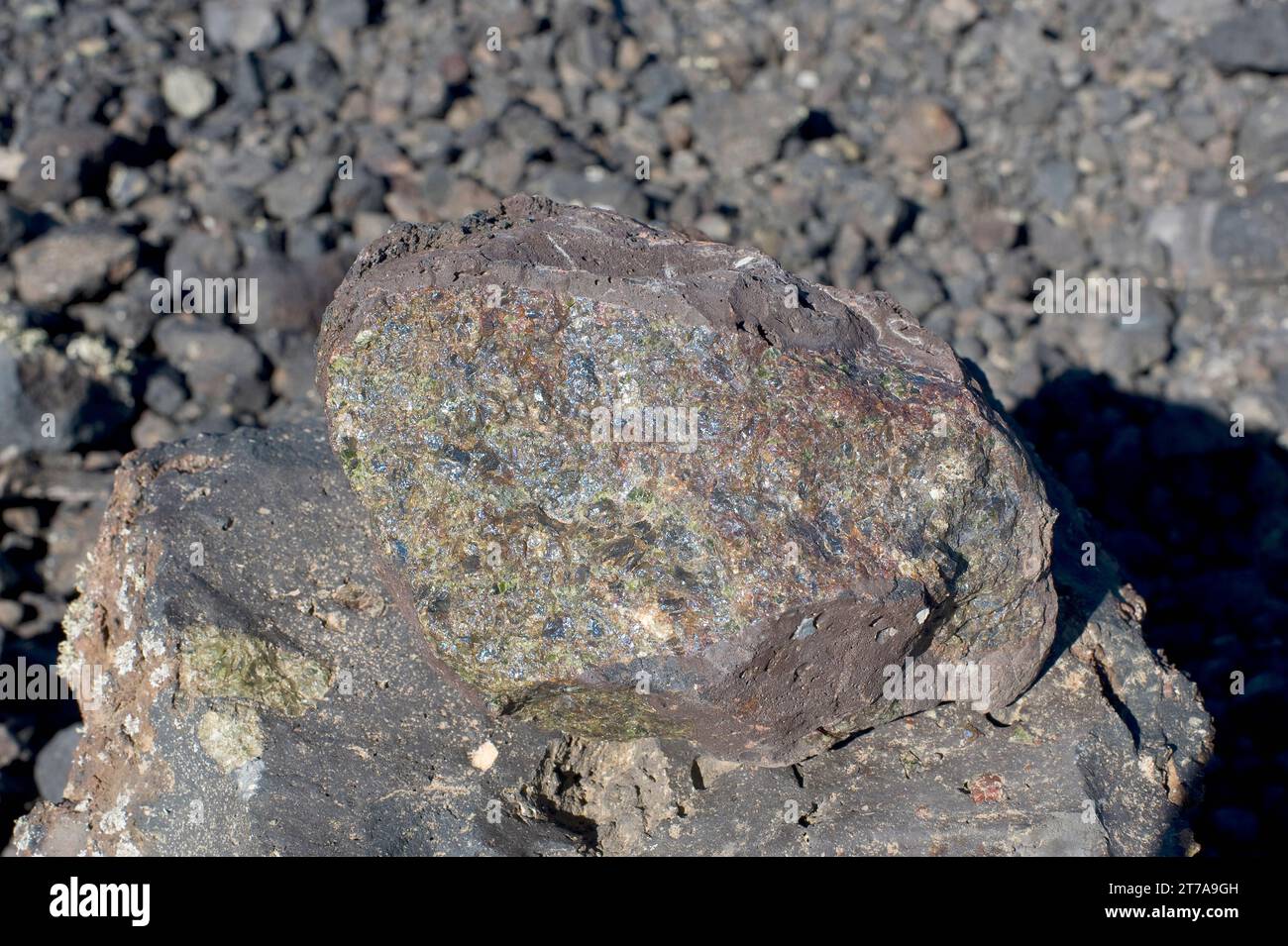 Olivine is a magnesium iron silicate mineral. This samples surrounded ...