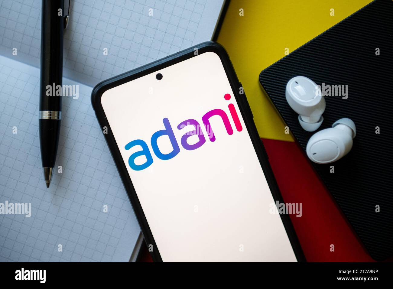 In this photo illustration a Adani logo seen displayed on a smartphone ...