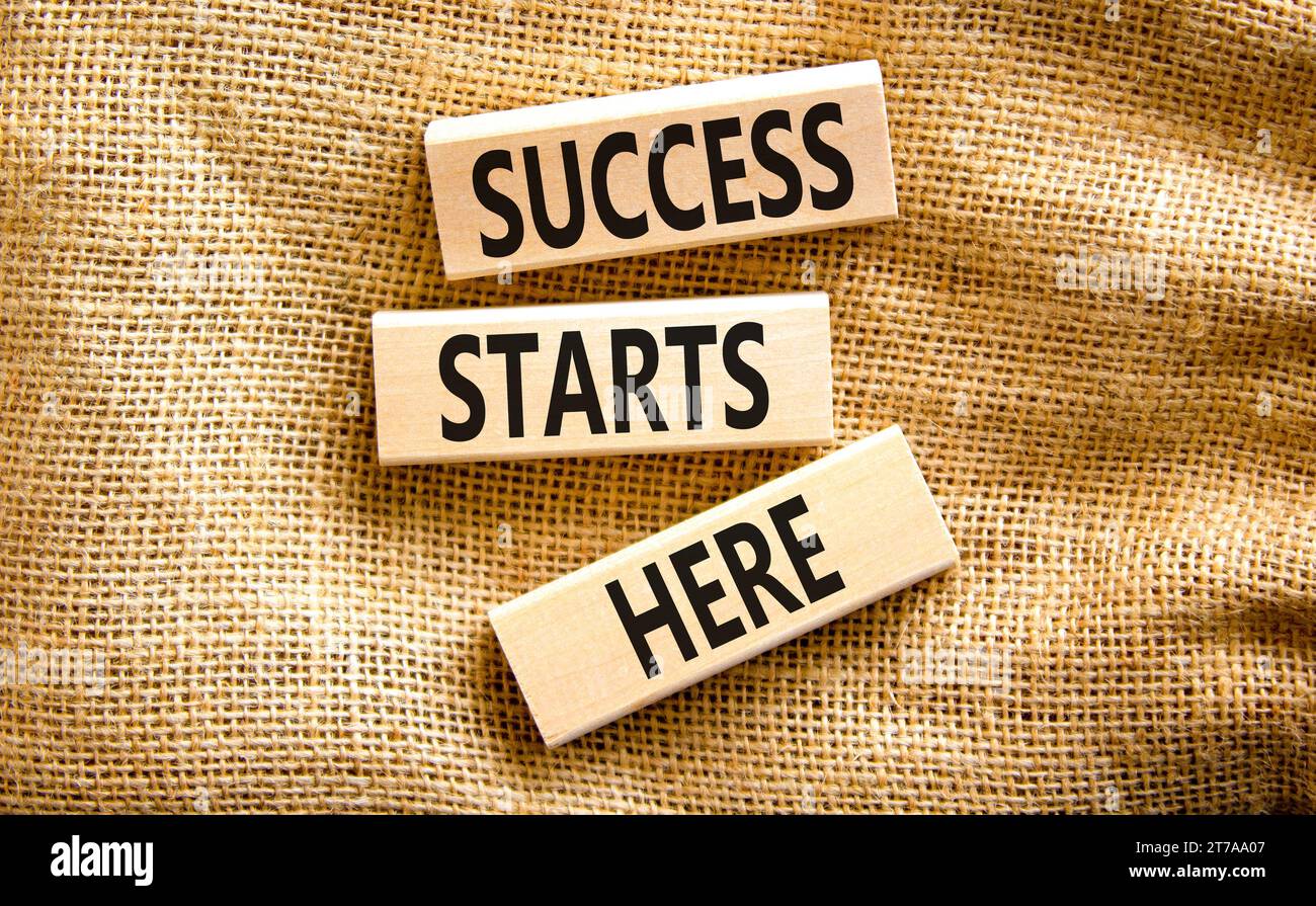 Success starts here symbol. Concept word Success starts here on beautiful wooden block ...