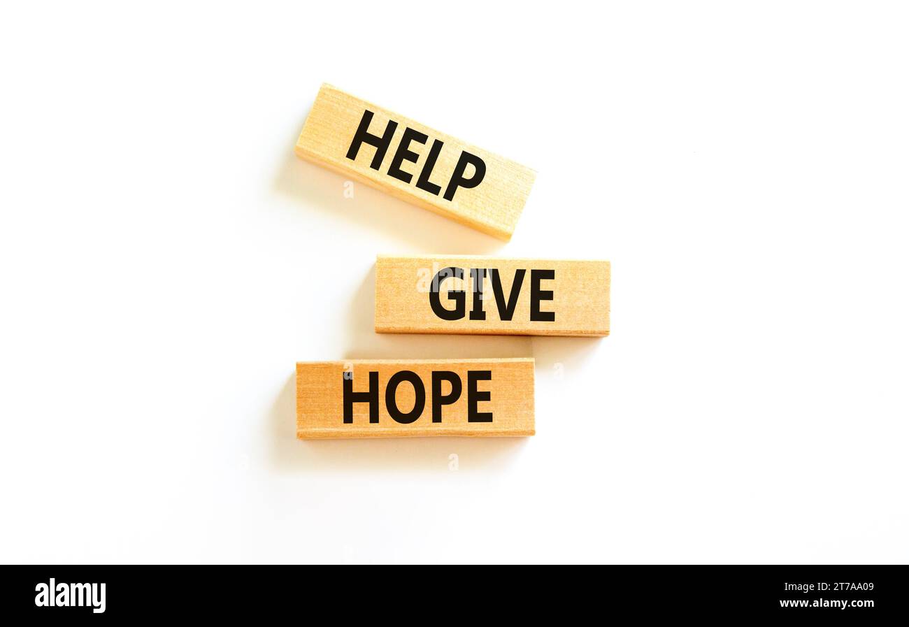 Help give hope symbol. Concept word Help give hope on beautiful wooden ...