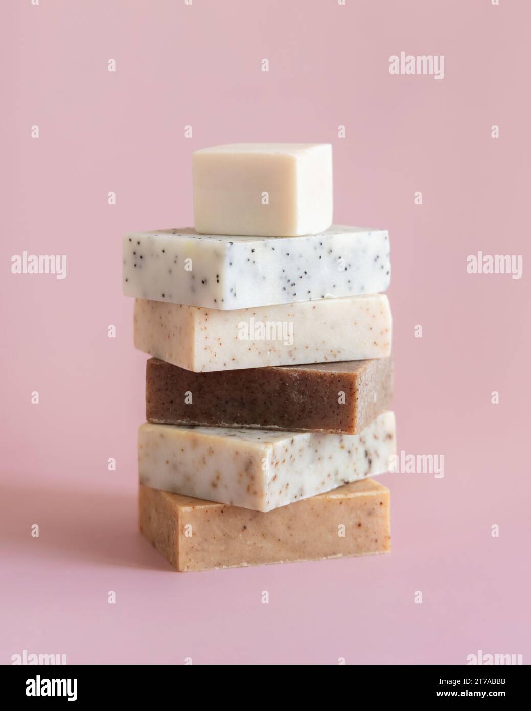 Tower stack of beige handmade soap bars on light pink close up. Natural ...