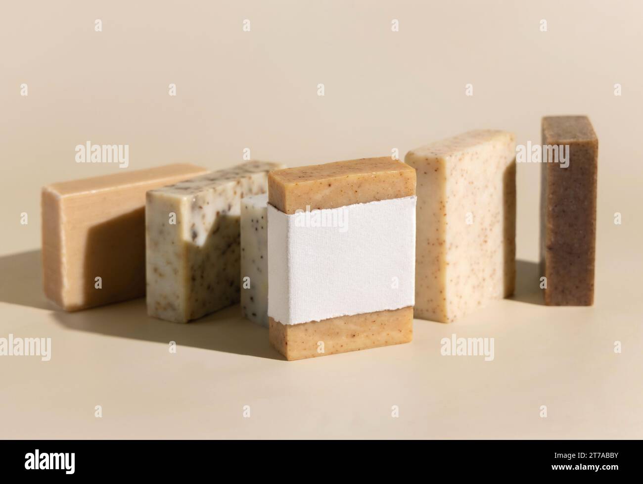 Beige and brown soap bars on light beige close up, hard shadows ...