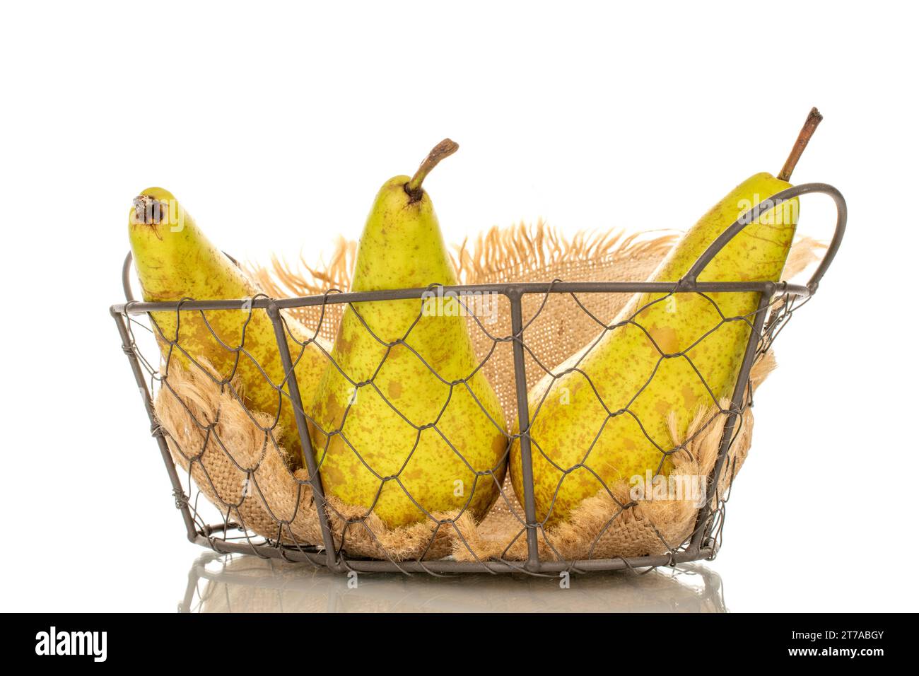 Three ripe pears in a basket, macro, isolated on white background Stock ...