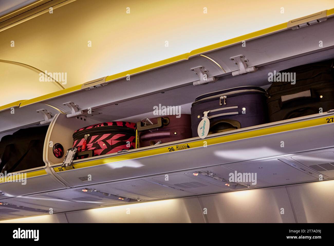 Overhead luggage compartments on Ryan Air flight Stock Photo - Alamy