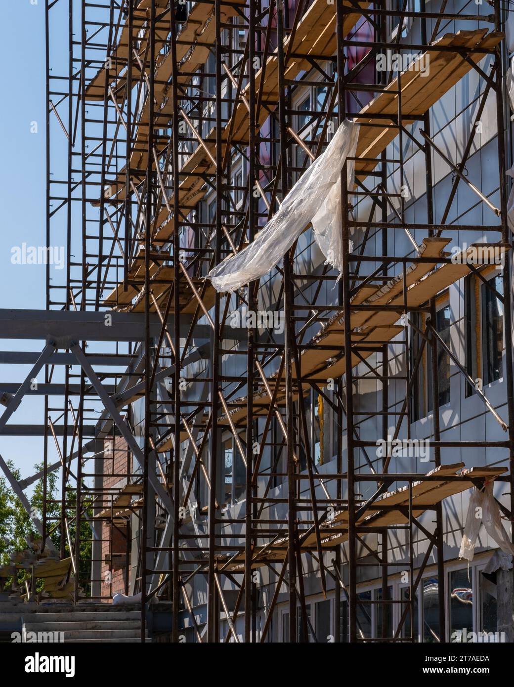 Construction of a building using scaffolding. Facade restoration work ...