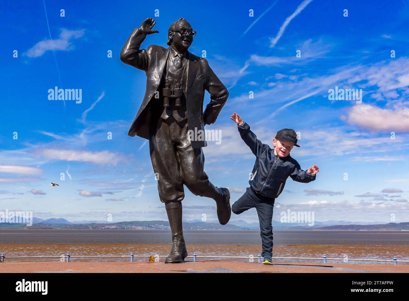 Eric Morecambe statue with young boy imitating the famous dance Stock ...
