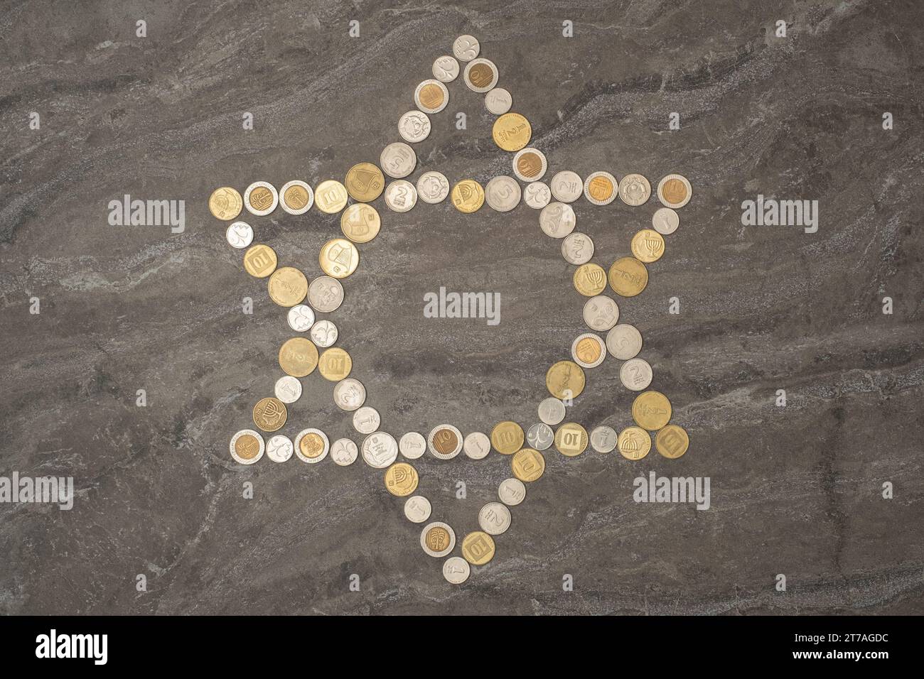 Israel's new shekel (NIS) coins arranged to form the shape of the Magen ...