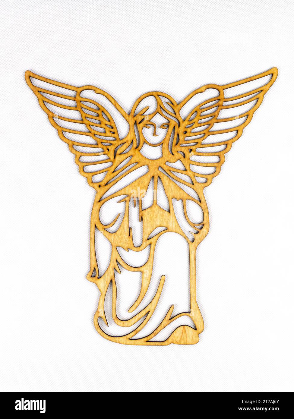 A wooden angel decoration with intricate details on a white background ...