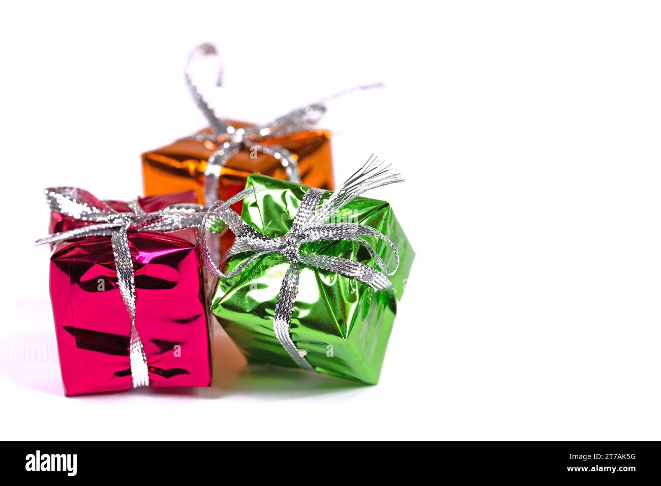 Colorful shiny packages against white background Stock Photo - Alamy