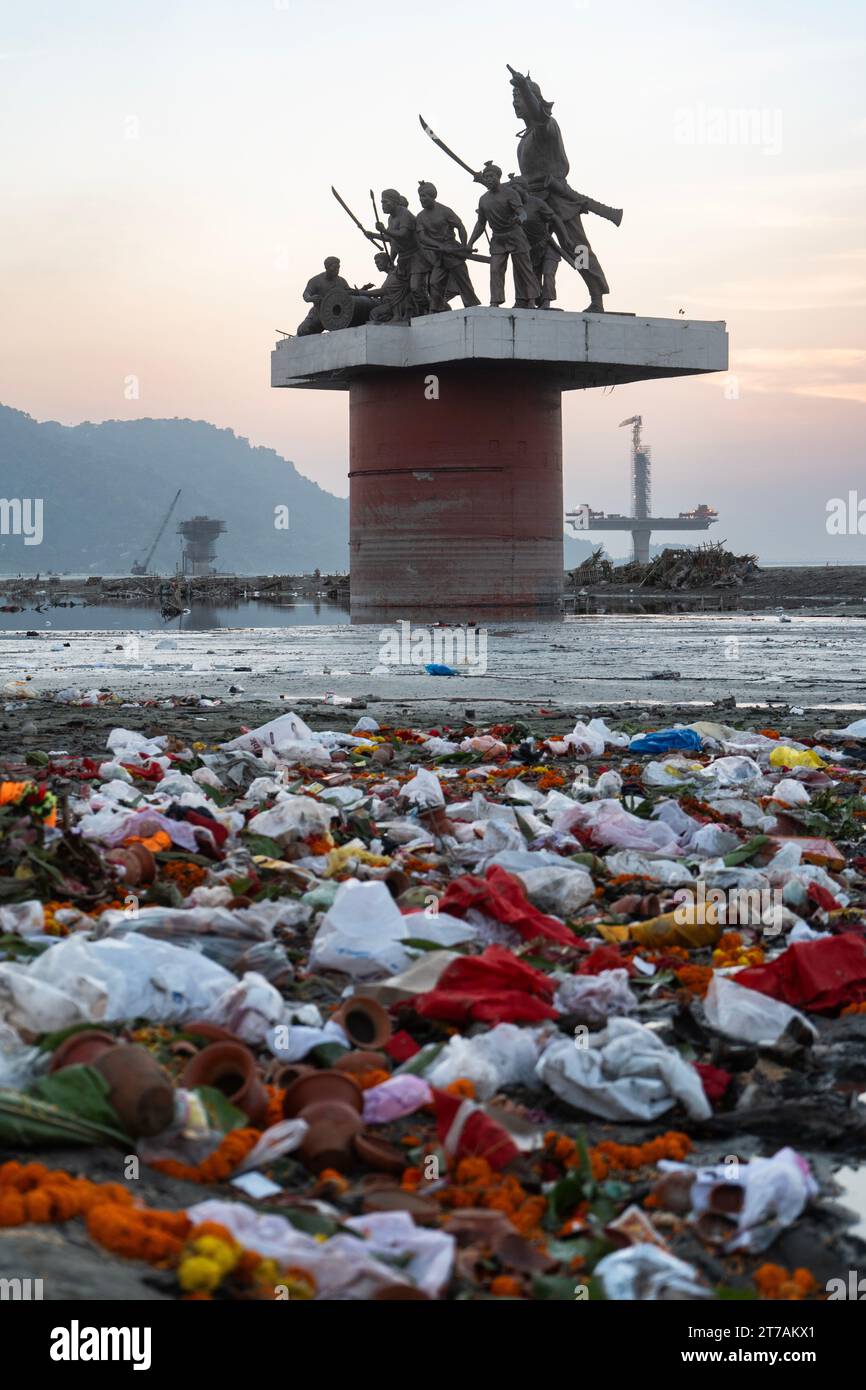 Plastic bags and puja ingredients and others litter the bank of the ...