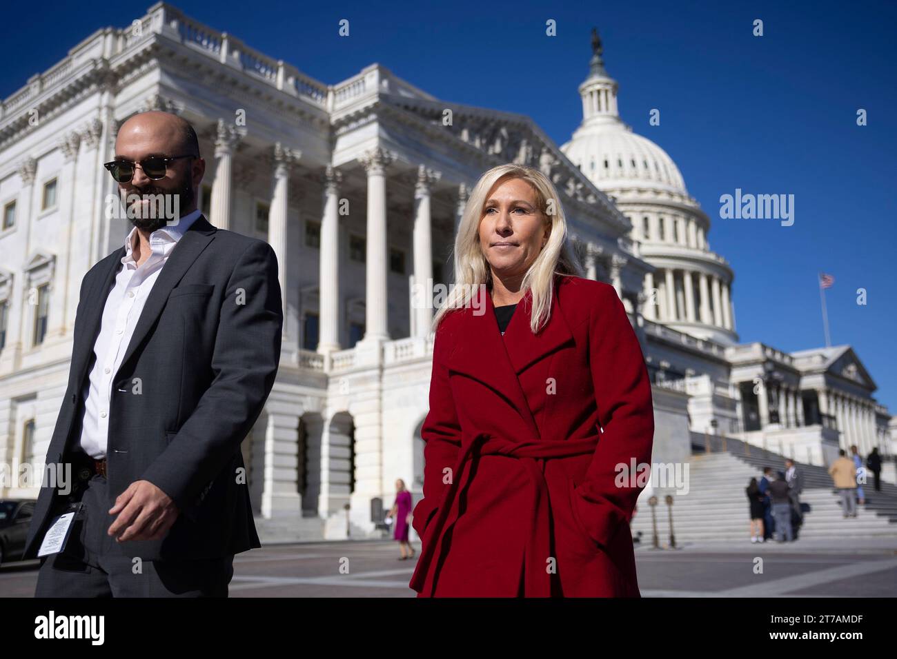 Rep. Marjorie Taylor Greene (R-Ga.) walks with an aide outside the U.S ...