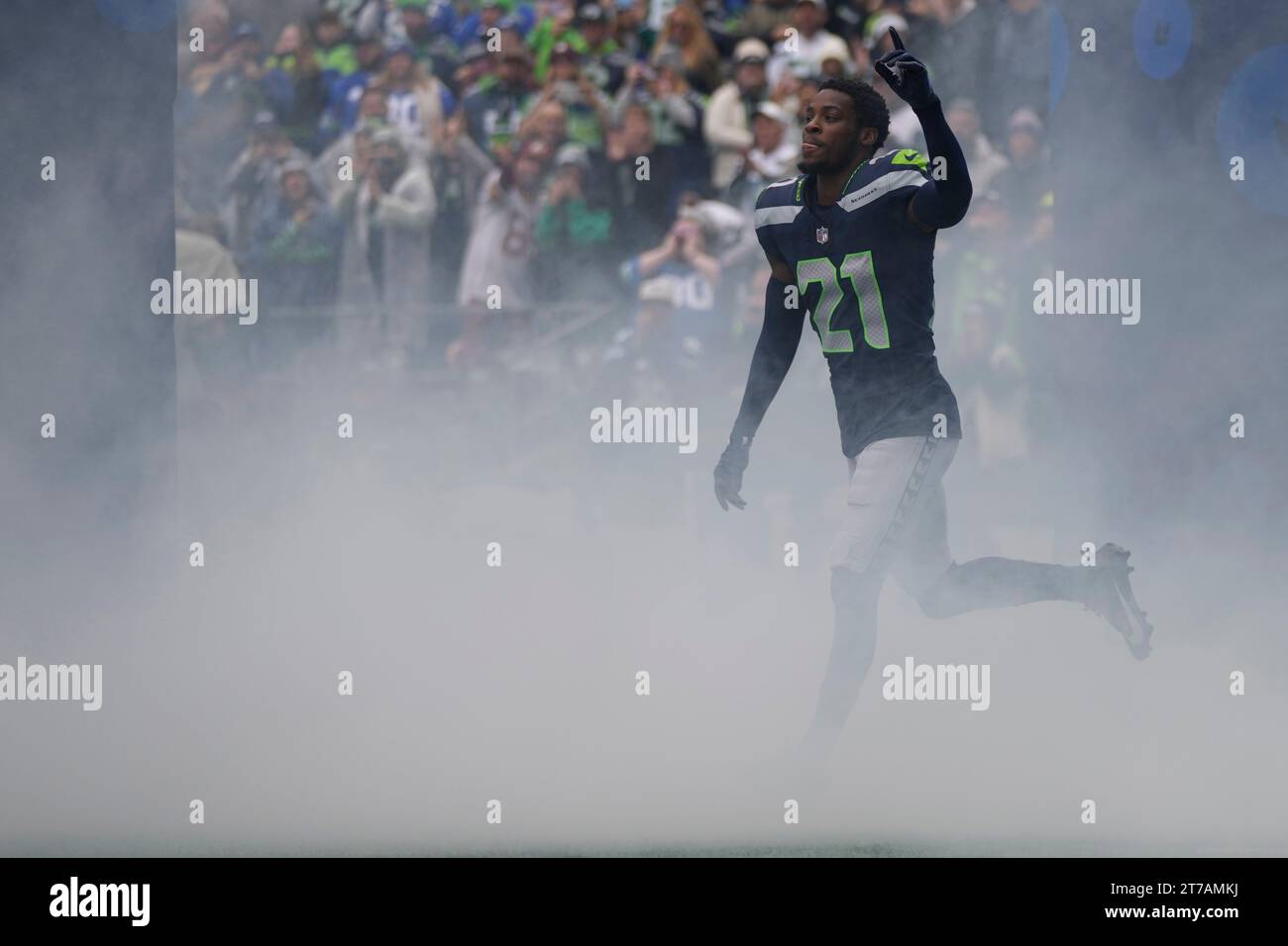 Seattle Seahawks cornerback Devon Witherspoon (21) runs onto the field ...