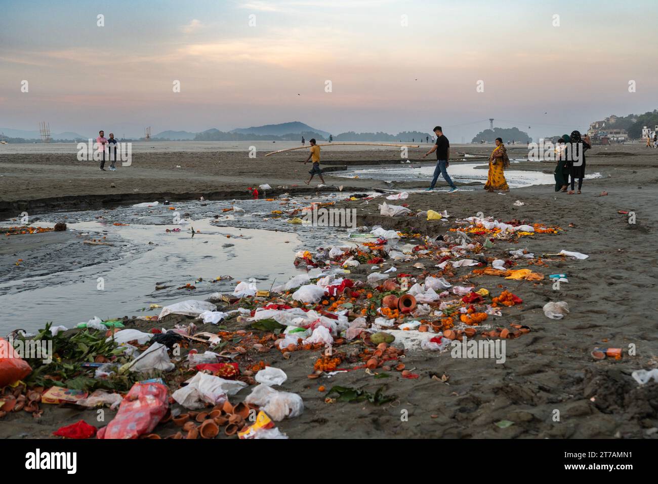 November 14, 2023: Plastic bags and puja ingredients and others litter ...