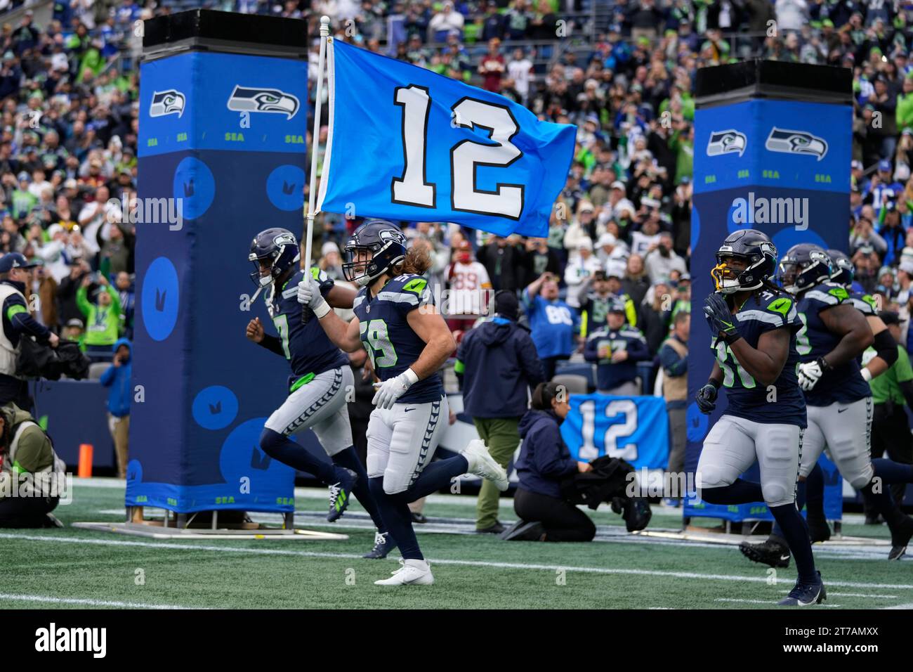 Seattle Seahawks quarterback Geno Smith (7), linebacker Jon Rhattigan ...