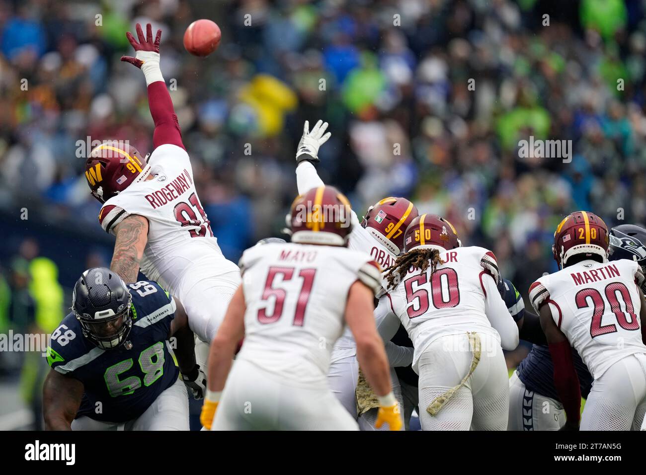 Washington Commanders defensive tackle John Ridgeway (91) attempts to ...