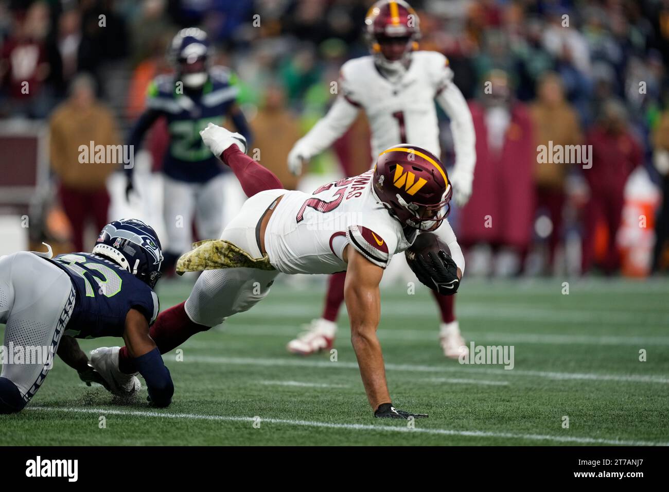 Washington Commanders tight end Logan Thomas (82) dives with the ball ...
