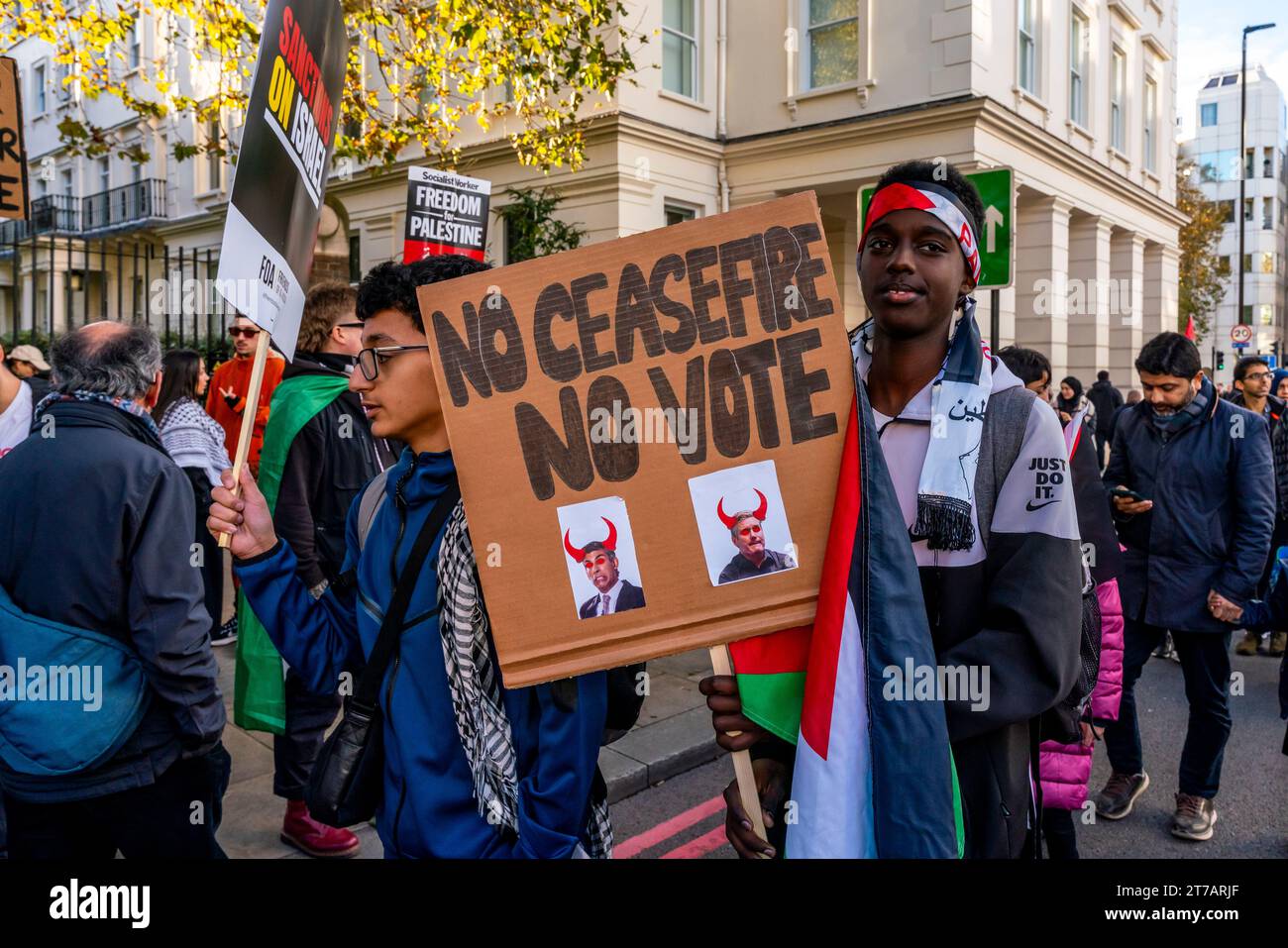 A Young Man Holds A 'No Ceasefire No Vote' Sign At The March for ...