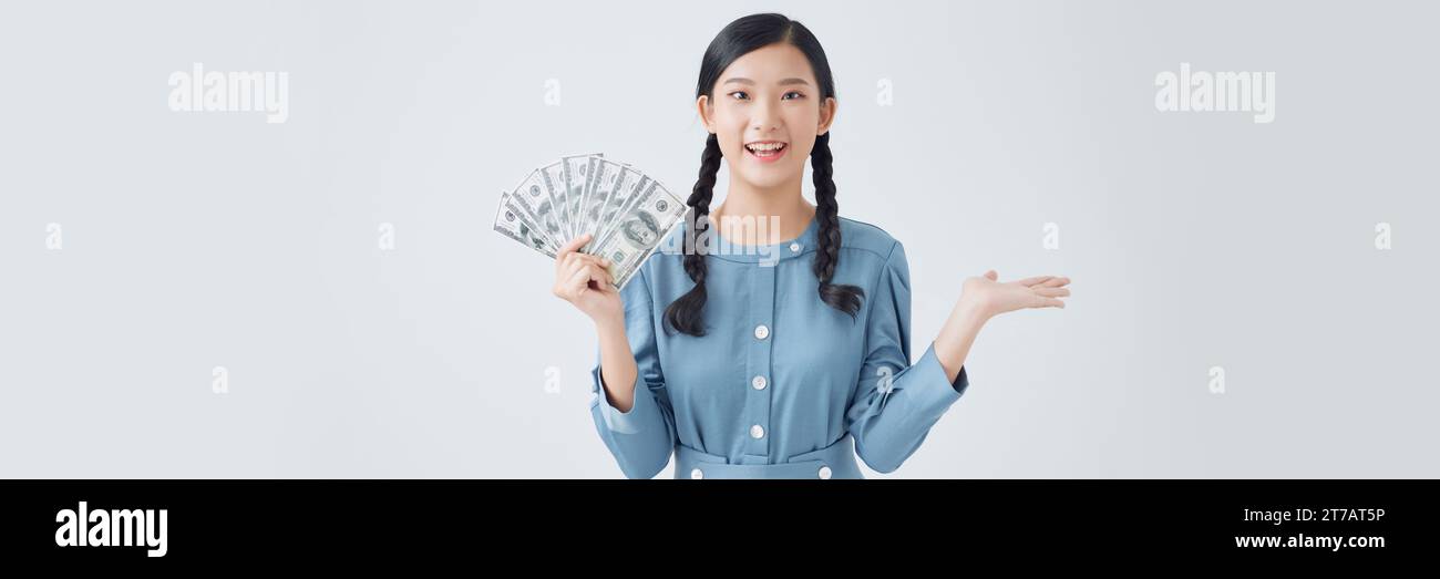 Attractive cheerful girl holding demonstrating fan cash salary income ...