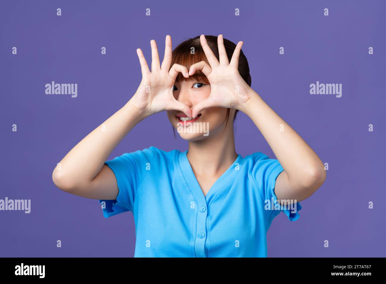 Portrait of adorable nice person arms fingers demonstrate heart symbol ...