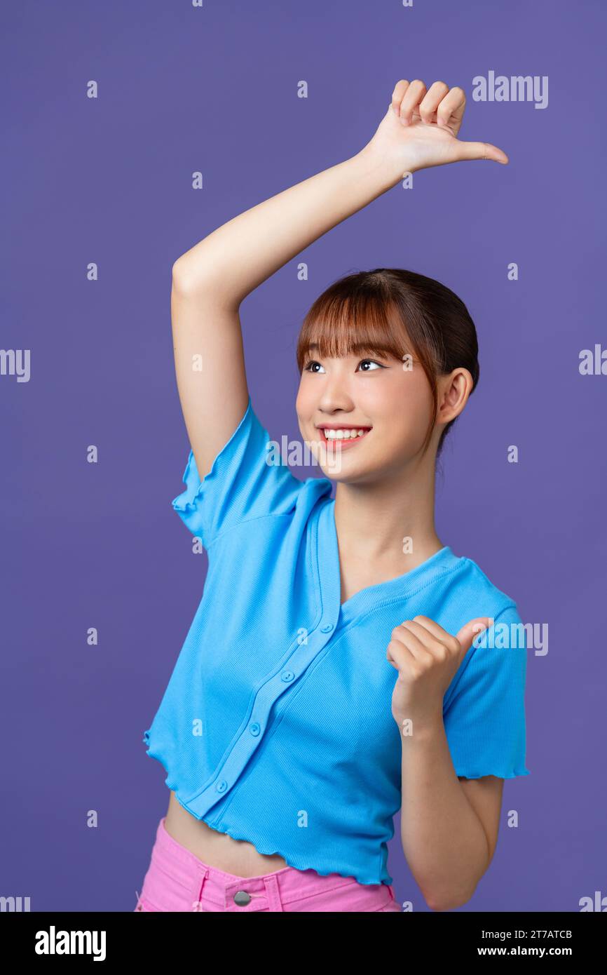 attractive cheerful girl demonstrating copy space ad new isolated over ...