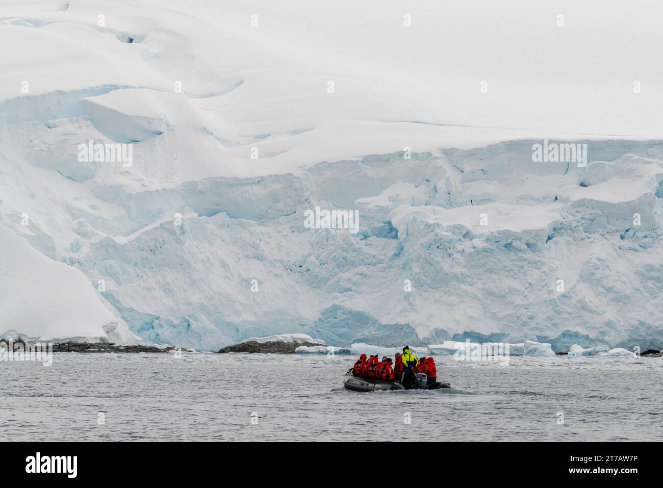 Tourists on inflatable boat exploring Curtiss Bay, Antarctica Stock ...