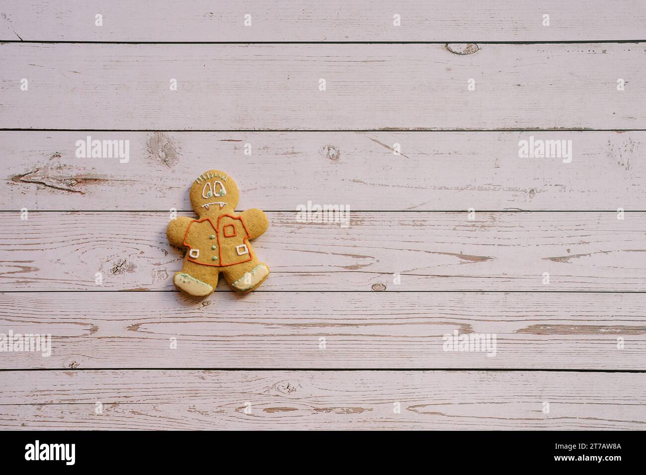 Gingerbread man vampire lies on a light wooden background Stock Photo ...