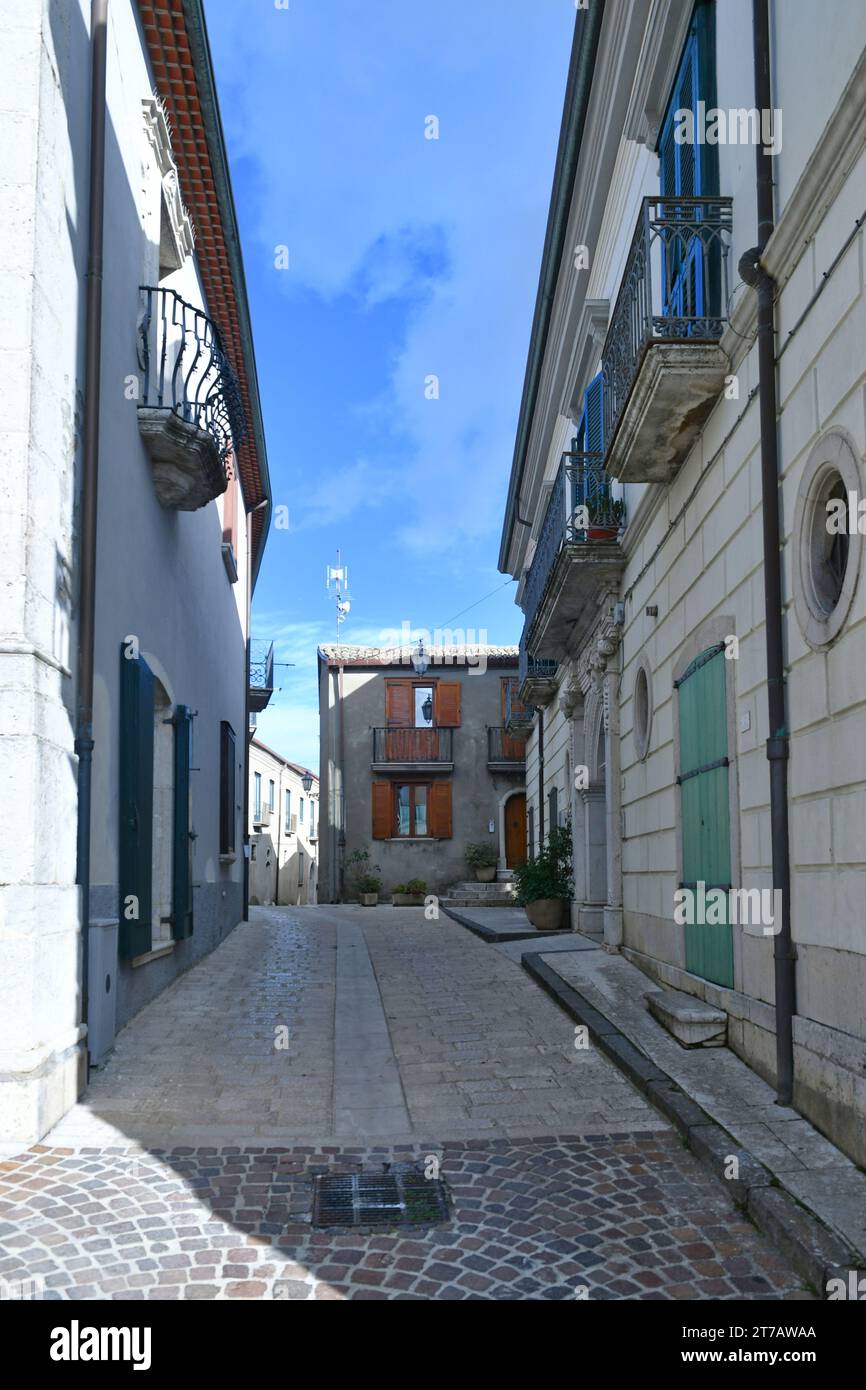 A narrow street among the old houses of Frigento, a town in Campania in ...