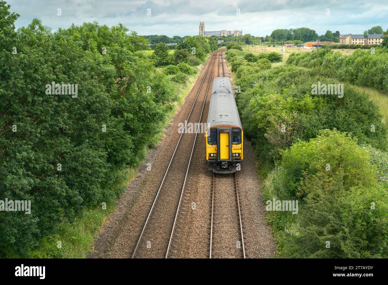 Railway train en route to Hull from Beverley with ancient Minster ...