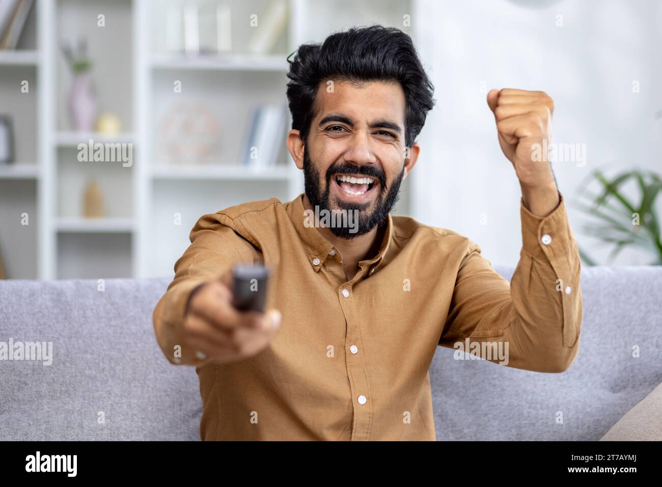Indian man watching television hi-res stock photography and images - Alamy