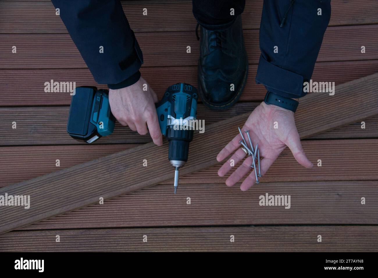 Carpentry building wooden deck, deck installation carpenter hands ...