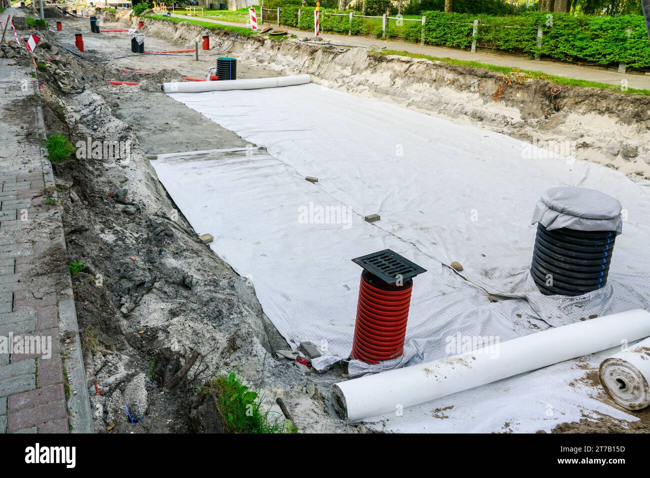 Use of geotextile fabric rolls for drainage and separation of base ...