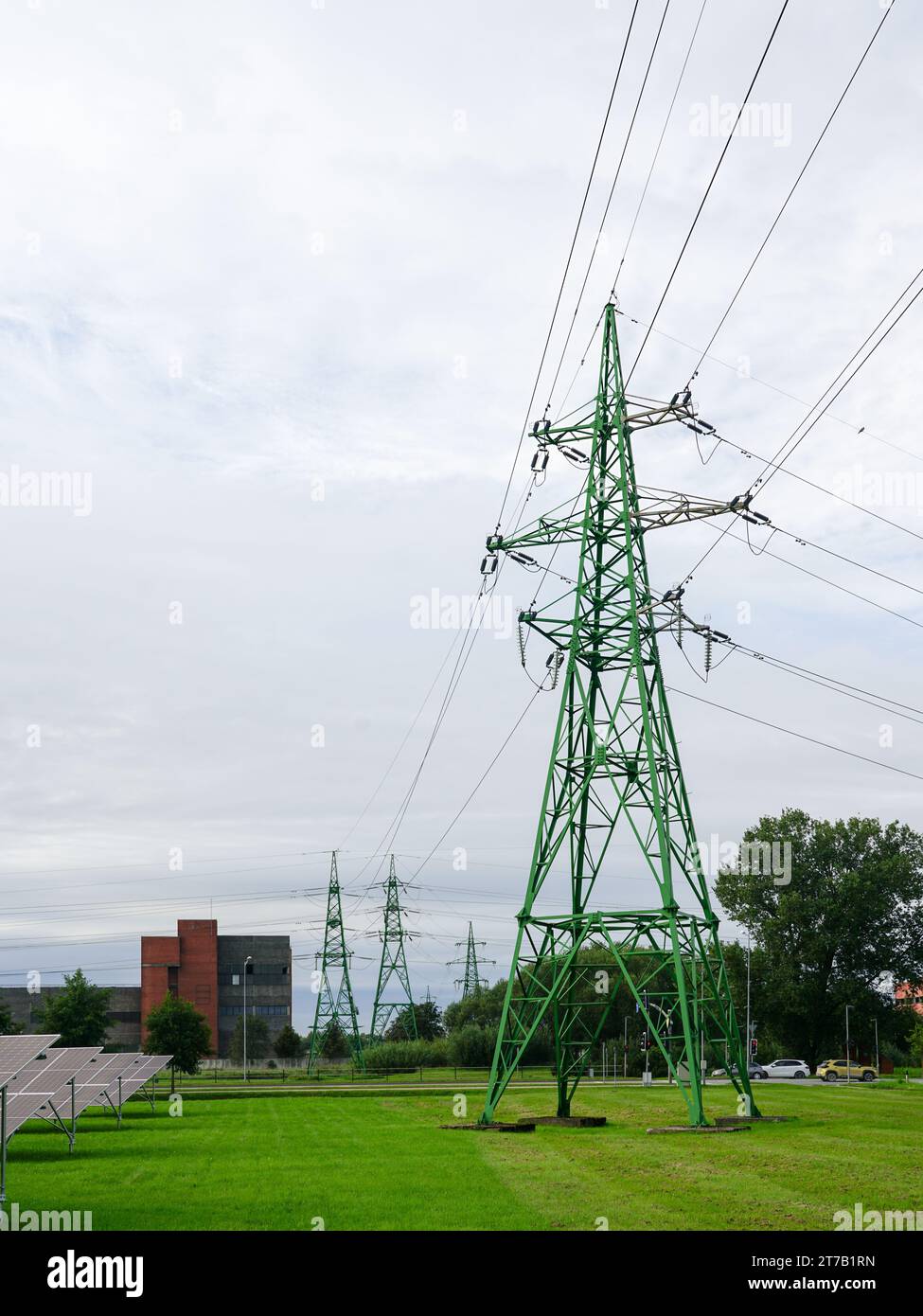 Industrial landscape with many high voltage power line poles and wires ...