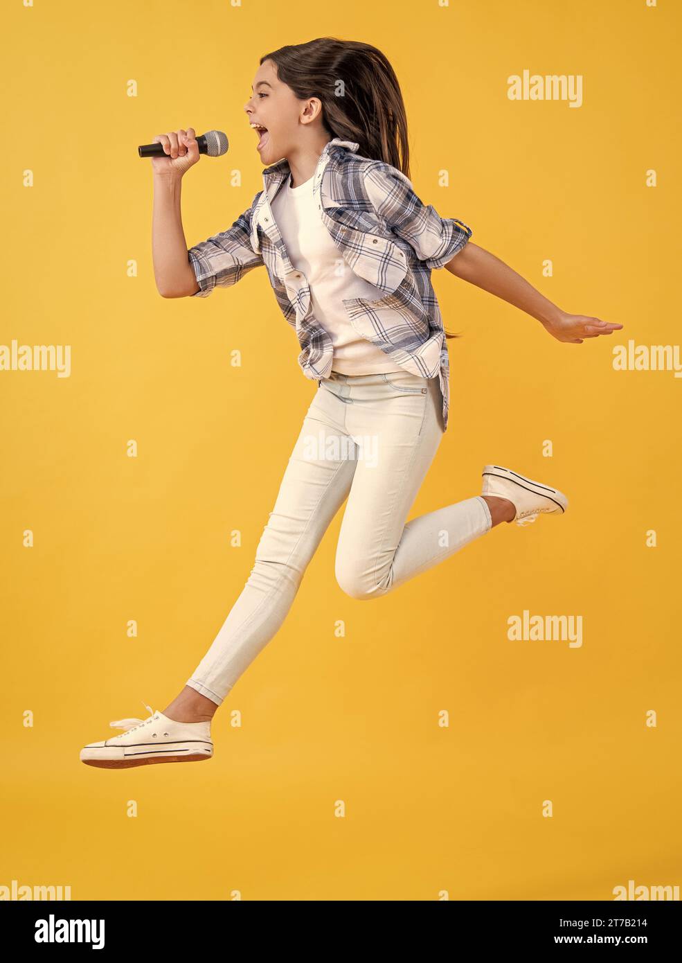 full length of teen girl karaoke singer with microphone. teen girl ...