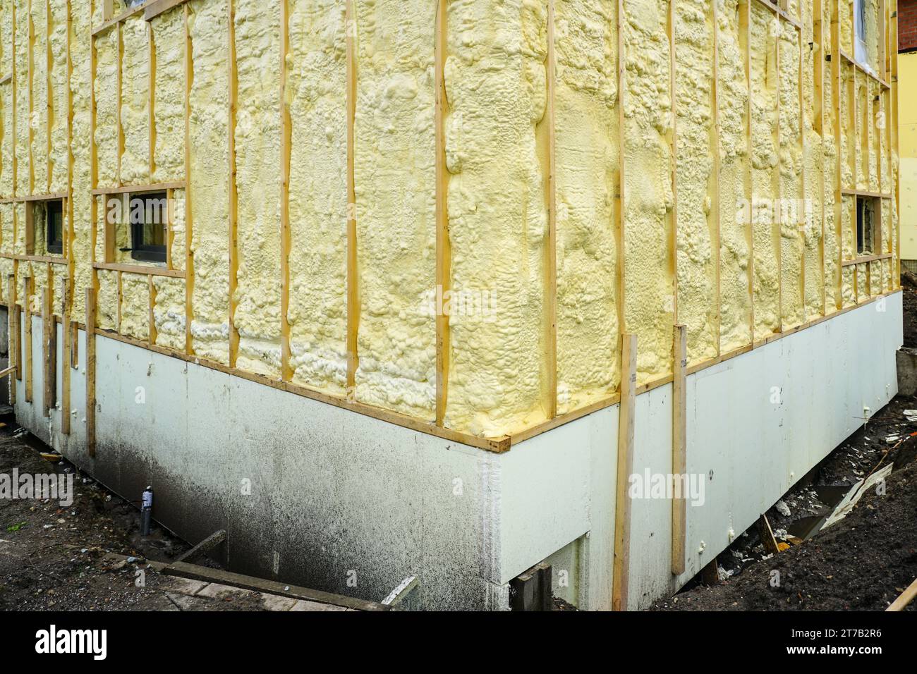 The facade of the residential house sprayed with a layer of polyurethane thermal insulation foam ...