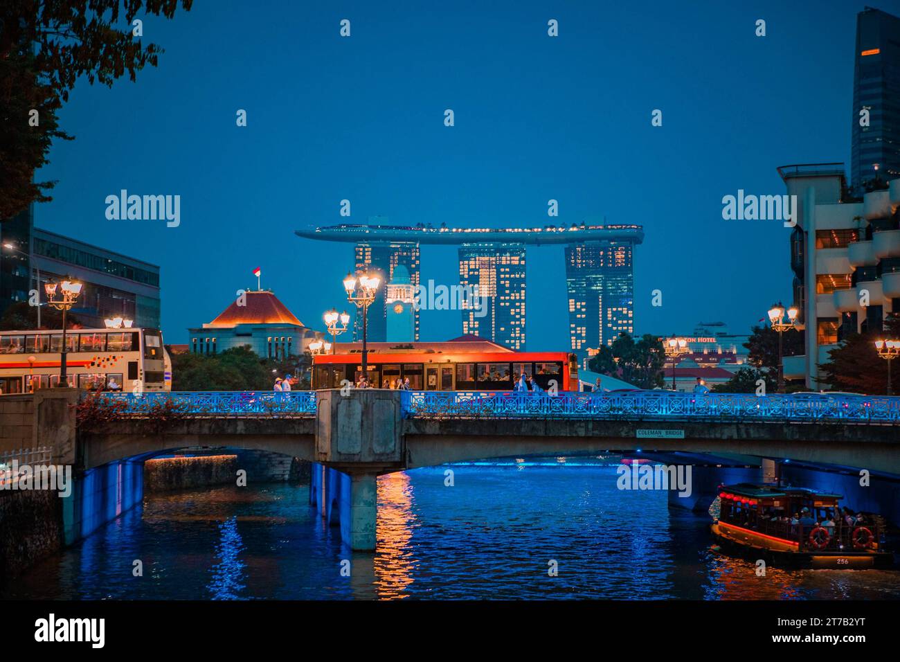 This image features a stunning nighttime view of a bridge illuminated ...
