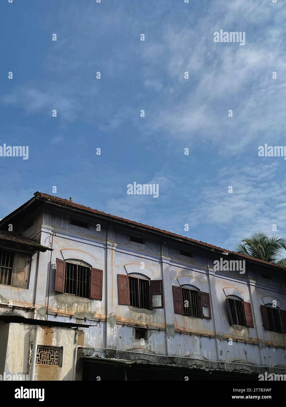 A modern blue office building surrounded by other corporate structures ...