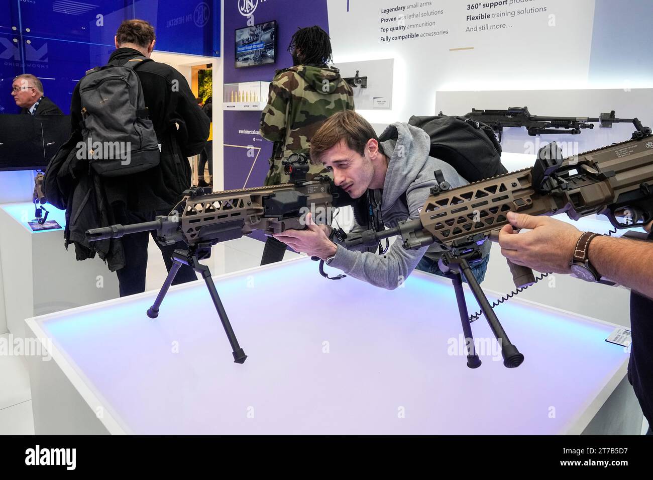 A man aims a FN EVOLYS Ultralight Machine Gun by Belgium FN Herstal at ...