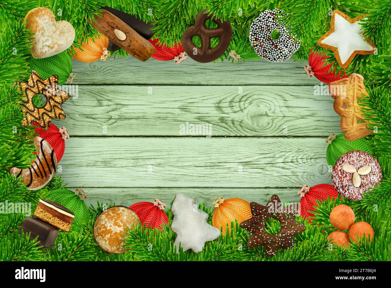 Frame and various Christmas sweets and cookies with fir branches and ...