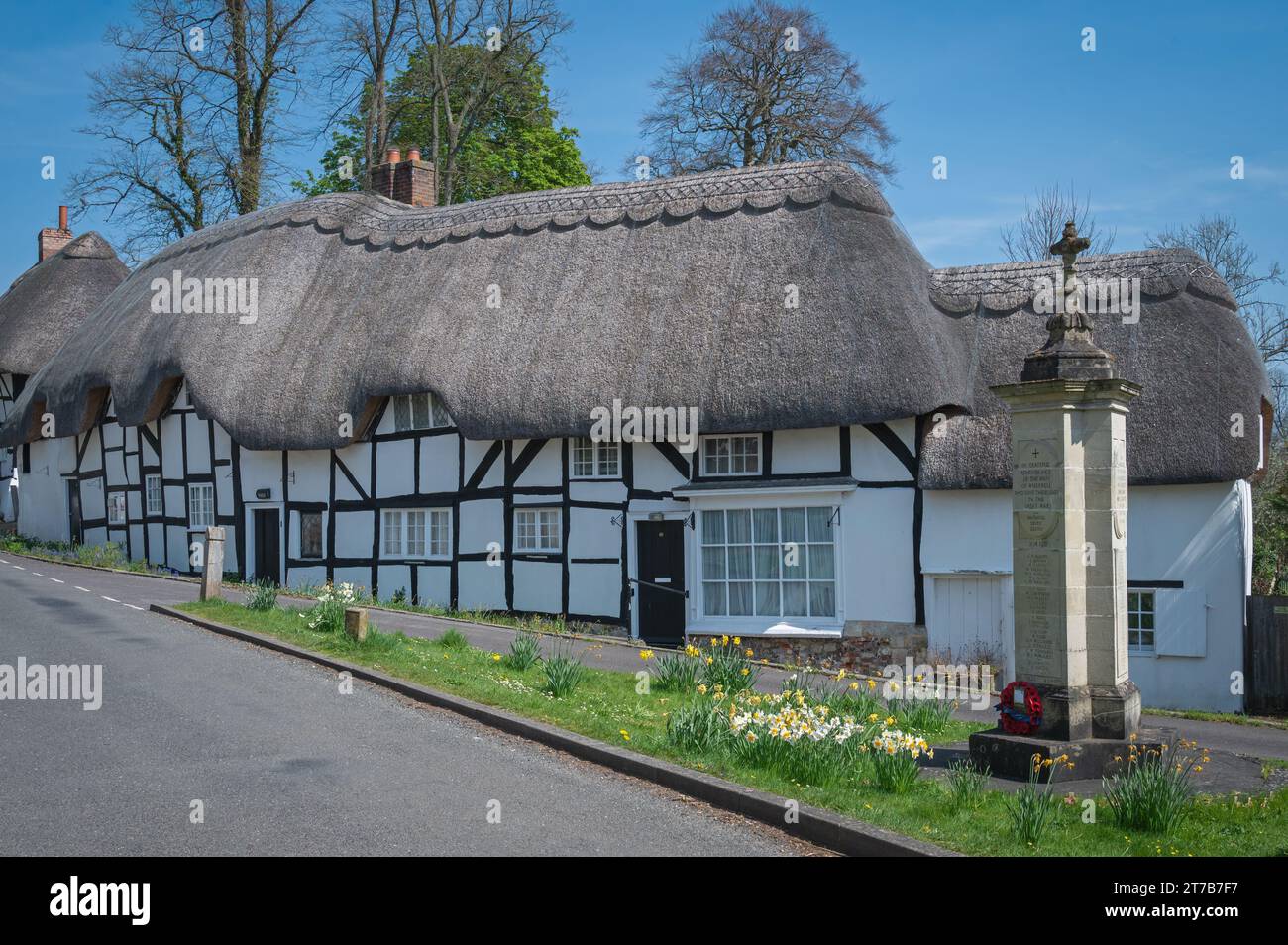 Traditional timber framed thatched cottages in Church Street, Wherwell ...