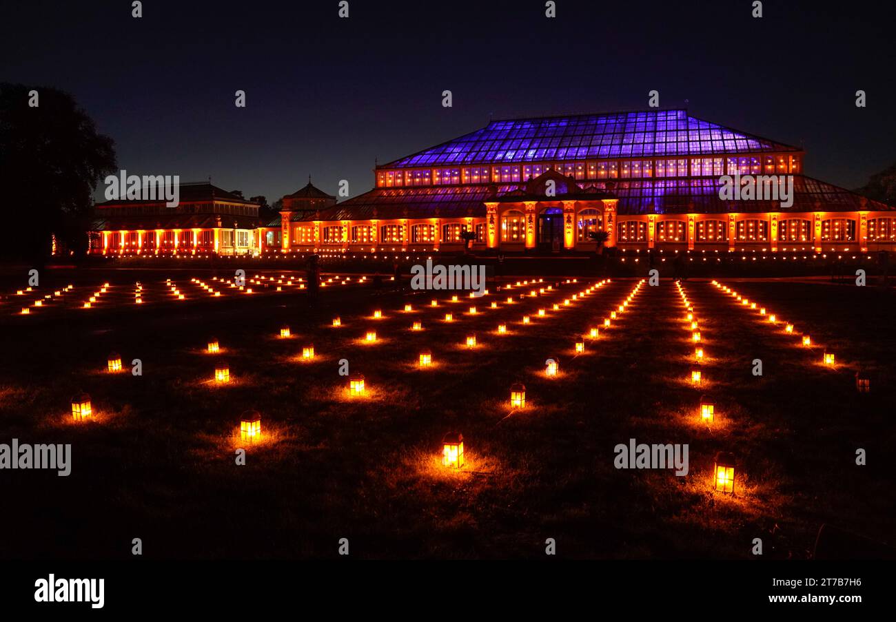 Candles are seen on the grass outside the Temperate House during a ...